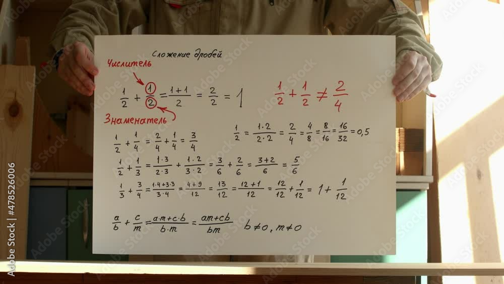 Mathematician Shows Paper With Calculations With Fractions And Numbers