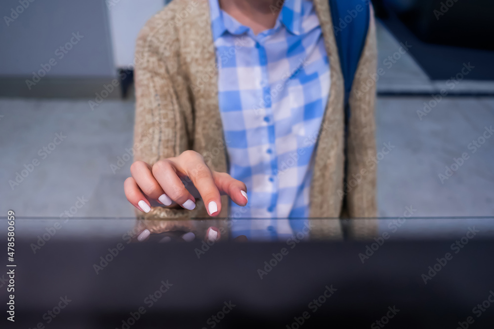 Woman hand using interactive touchscreen display of electronic ...