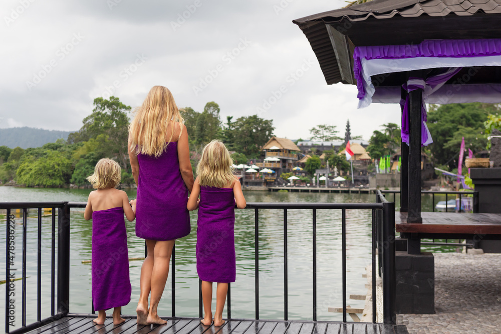 Happy family in Batur volcano hot spring spa. Travel in Kintamani, Bali ...
