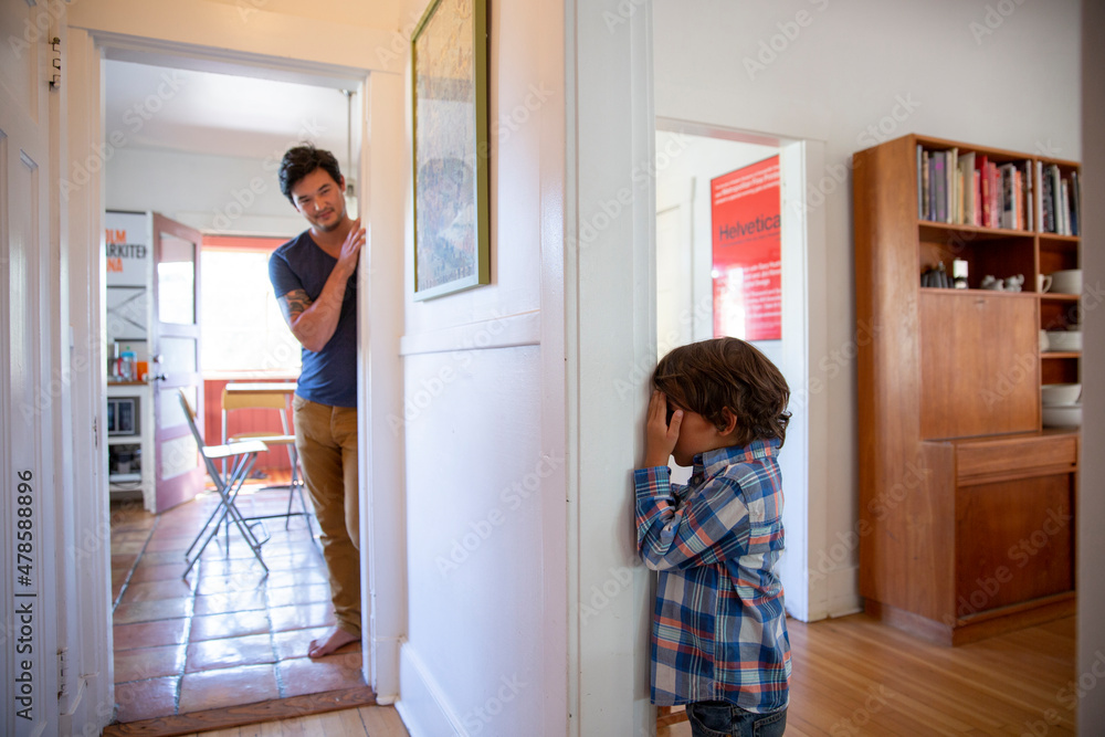 Father and son playing hide and seek Stock Photo | Adobe Stock