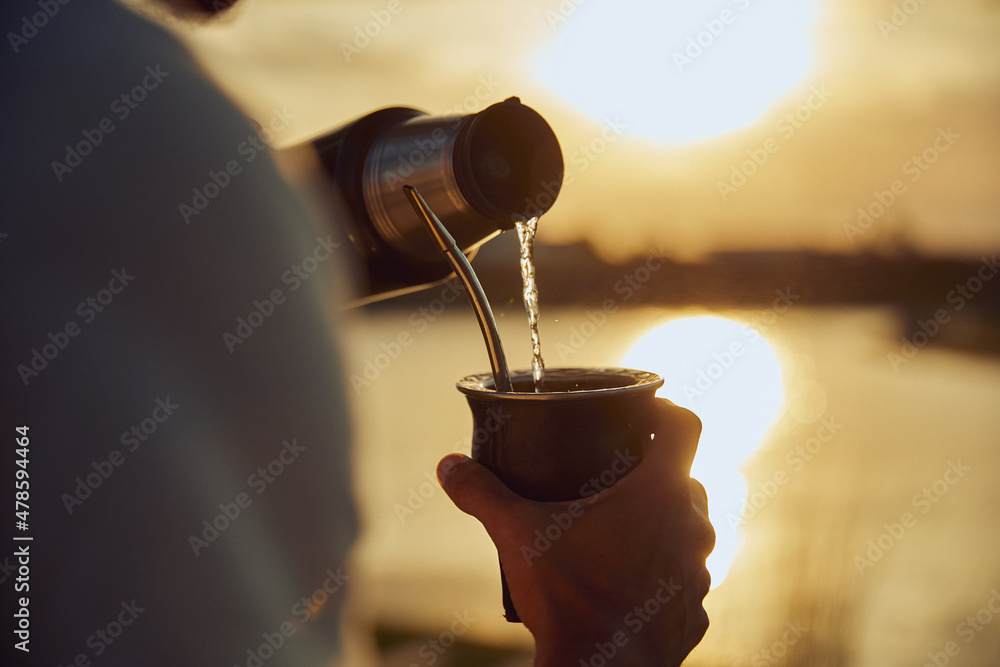 Tomando Mate Argentino a la orilla del rio. Stock Photo | Adobe Stock