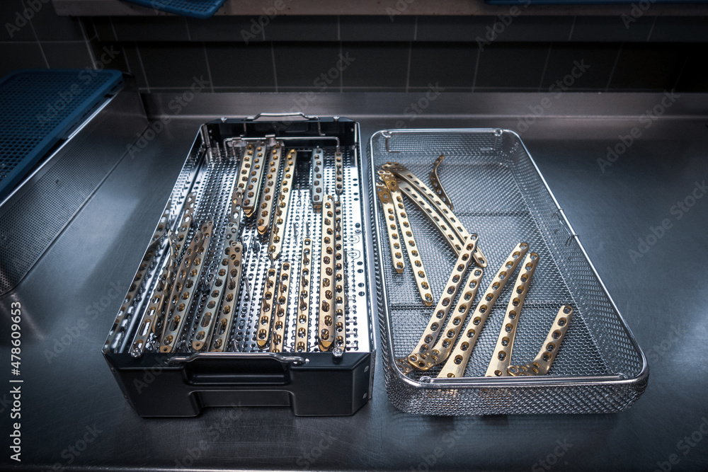 many gold-colored titanium plates for the treatment of femoral ...