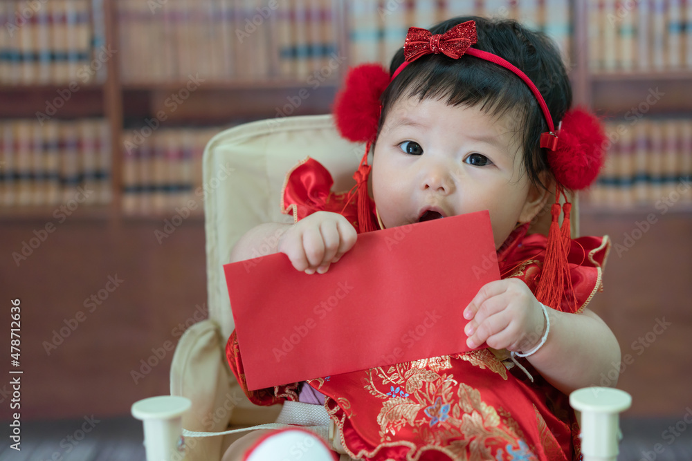 Chinese Infant baby girl get Angpao in her hand as concept of Chinese ...