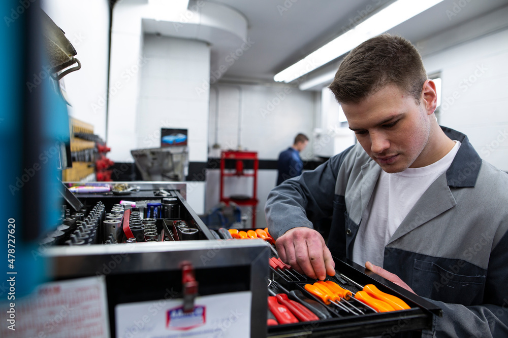 Mechanic selecting tool from toolbox auto repair shop Stock Photo ... Mechanic selecting tool from toolbox auto repair shop Stock Photo ...