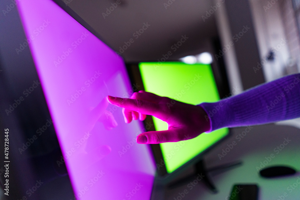 Working woman touching illuminated desktop screen at home office Stock ...