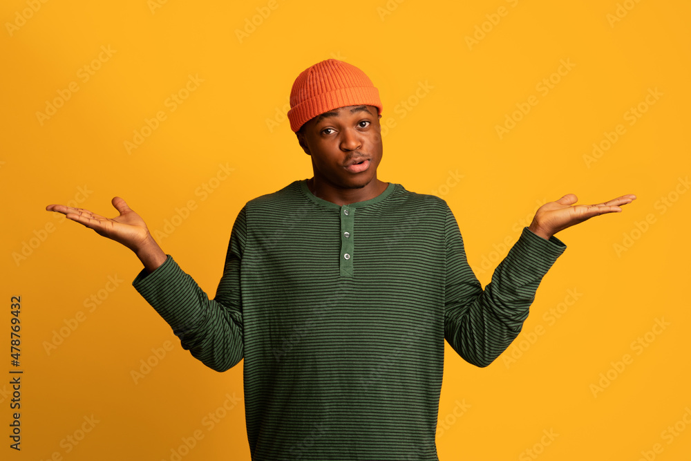 Who Knows. Doubtful Young Black Man Shrugging Shoulders And Spreading ...