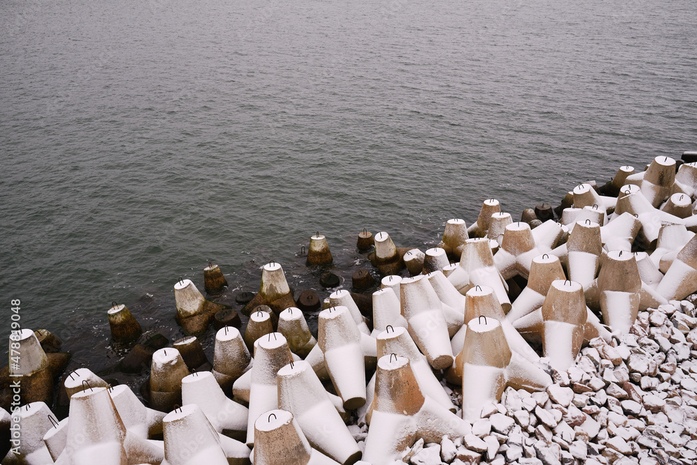 Poster Concrete massive breakwaters on the sea coast to protect the ...