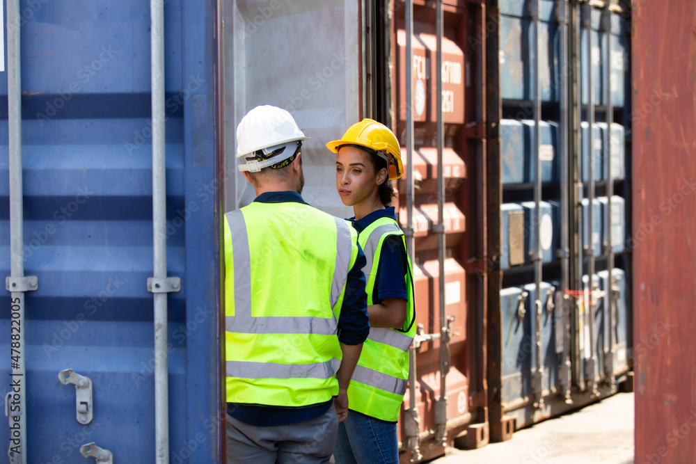 Hispanic Man worker and woman Supervisor dock cargo checking and ...