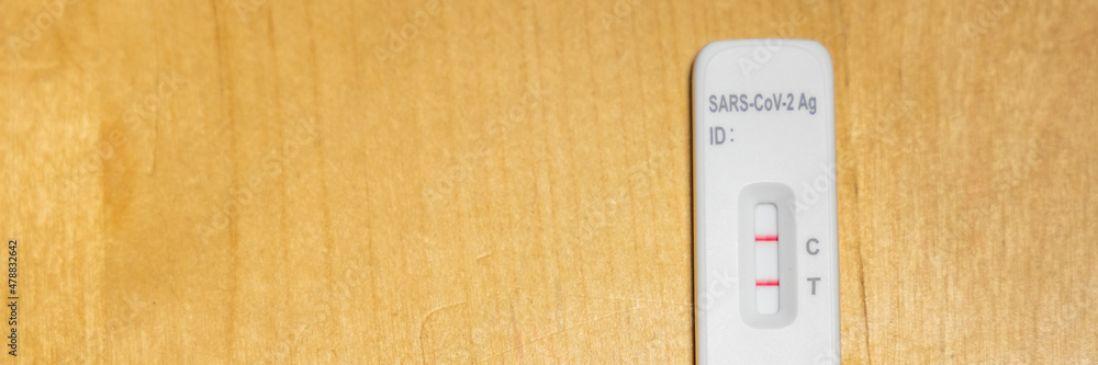 Positive covid-19 auto test with two red lines appearing on the test ...