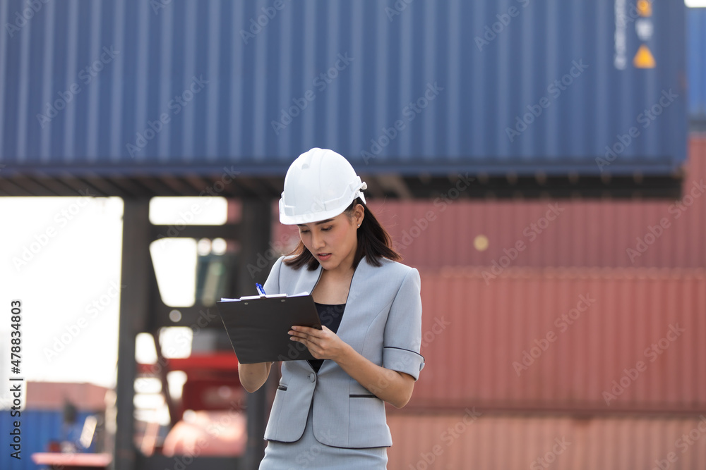 Asian business Women manager control loading Containers box from Cargo ...