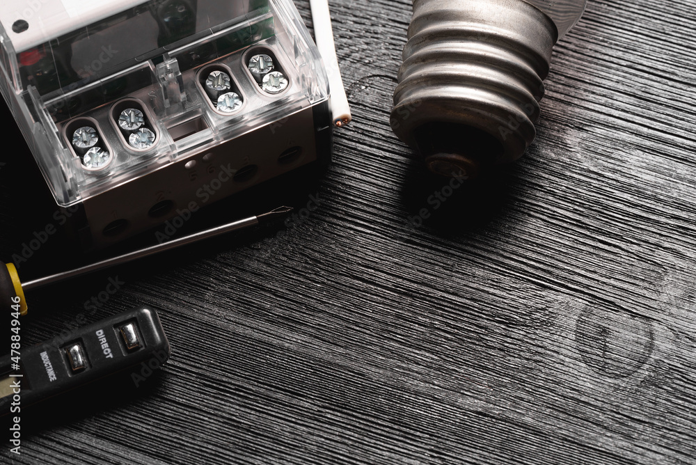 Electric equipment background with copy space. Electric meter, light ...