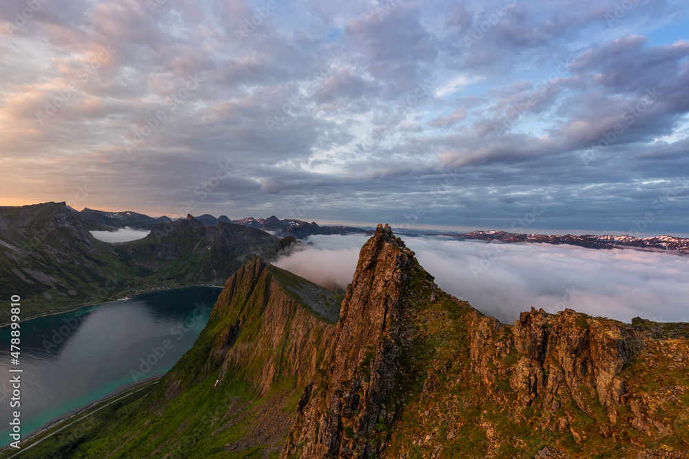 Scenic views of the mountains and fjords. The rocks are lit by the sun ...