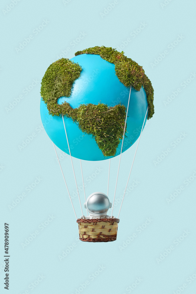 Astronaut flying in air balloon earth Stock Photo | Adobe Stock