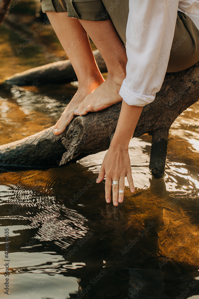 Female hand touching water Stock Photo | Adobe Stock