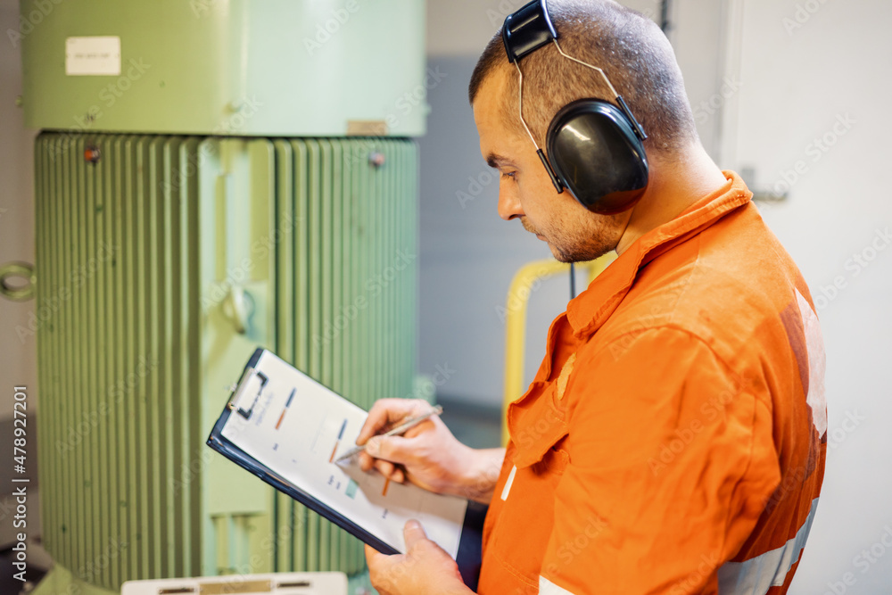 mechanic motor inspection with checklist Stock Photo | Adobe Stock