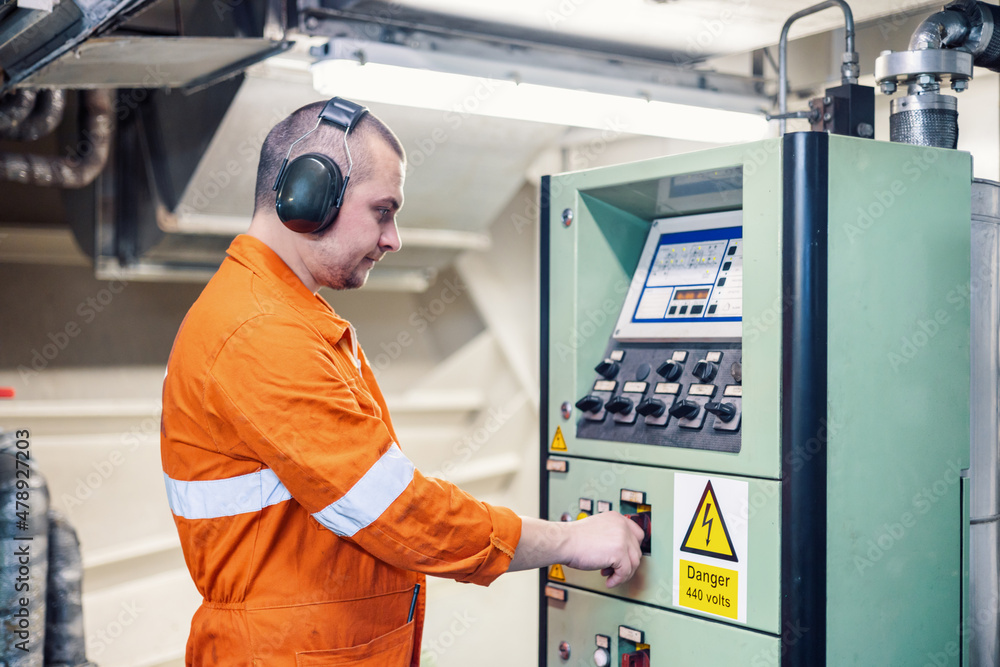 Ship mechanic doing test of main engine Stock Photo | Adobe Stock