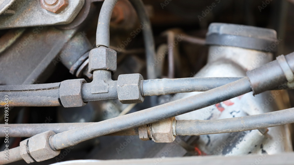 Old metal three-way coupling. Junction joint and straight coupling on ...