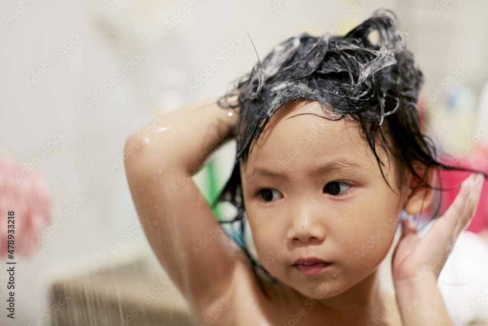 Cute Asian little girl playing in the bath Stock Photo | Adobe Stock