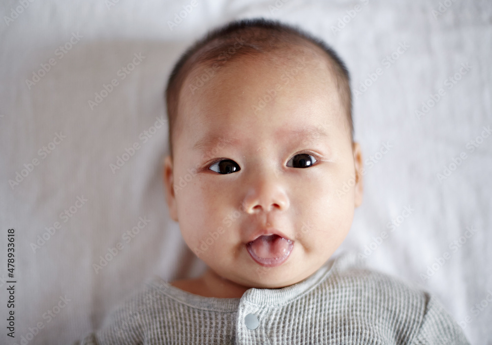 Closeup expression of Asian newborn baby Stock Photo | Adobe Stock