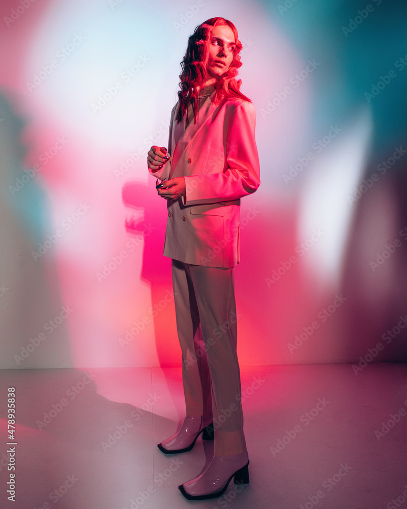 Transgender portrait full body in pink suit Stock Photo | Adobe Stock
