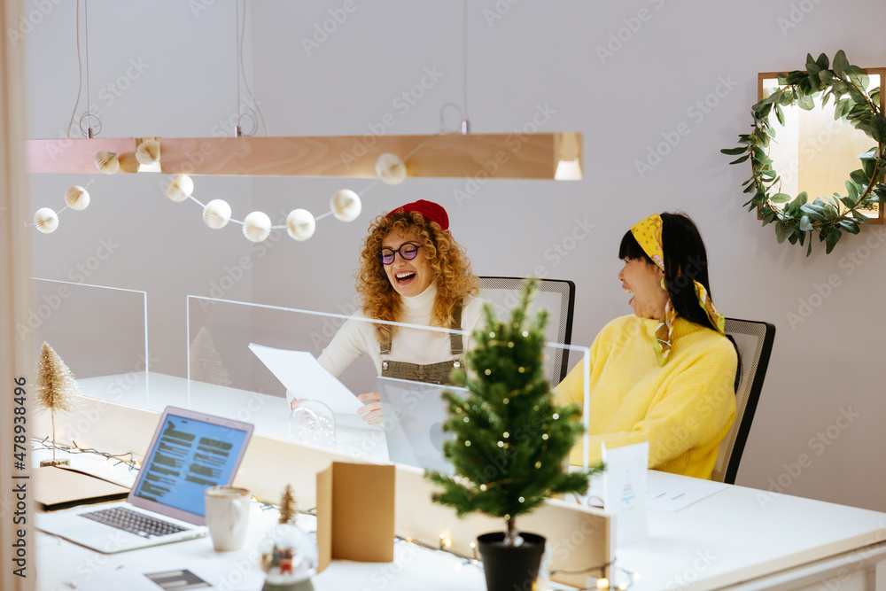 Happy diverse women doing paperwork Stock Photo | Adobe Stock