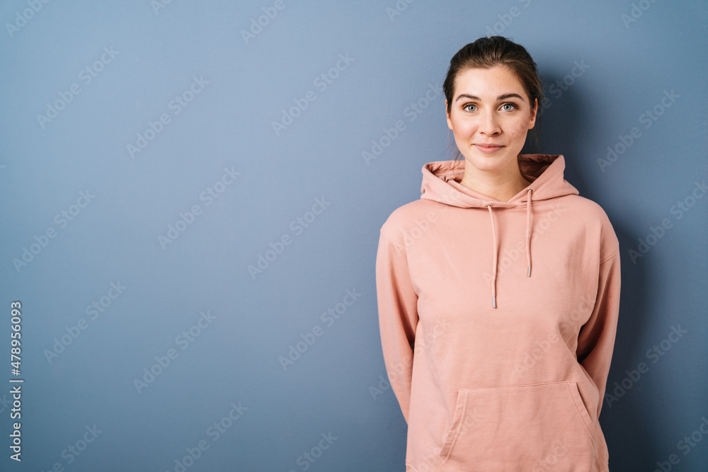 Cute pert young woman giving the camera a quiet smile Stock Photo ...
