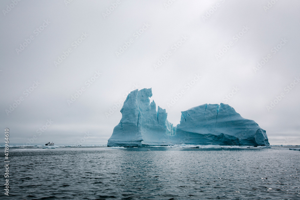 Icebergs floating in the melting sea ice in the Davis Strait. Stock ...