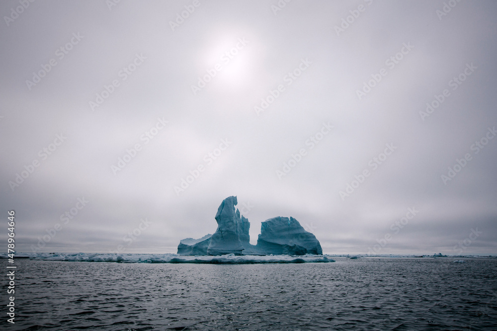Icebergs floating in the melting sea ice in the Davis Strait. Stock ...