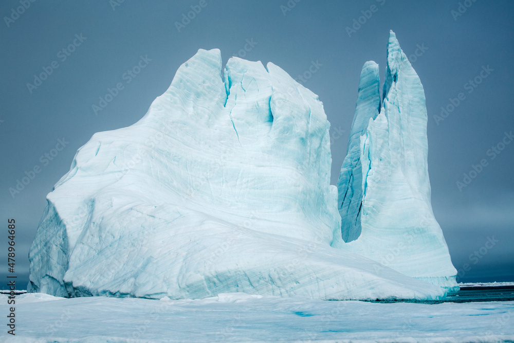 Icebergs floating in the melting sea ice in the Davis Strait. Stock ...