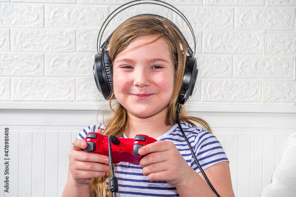 Kids gamers concept. Caucasian preteen little child girl holding ...