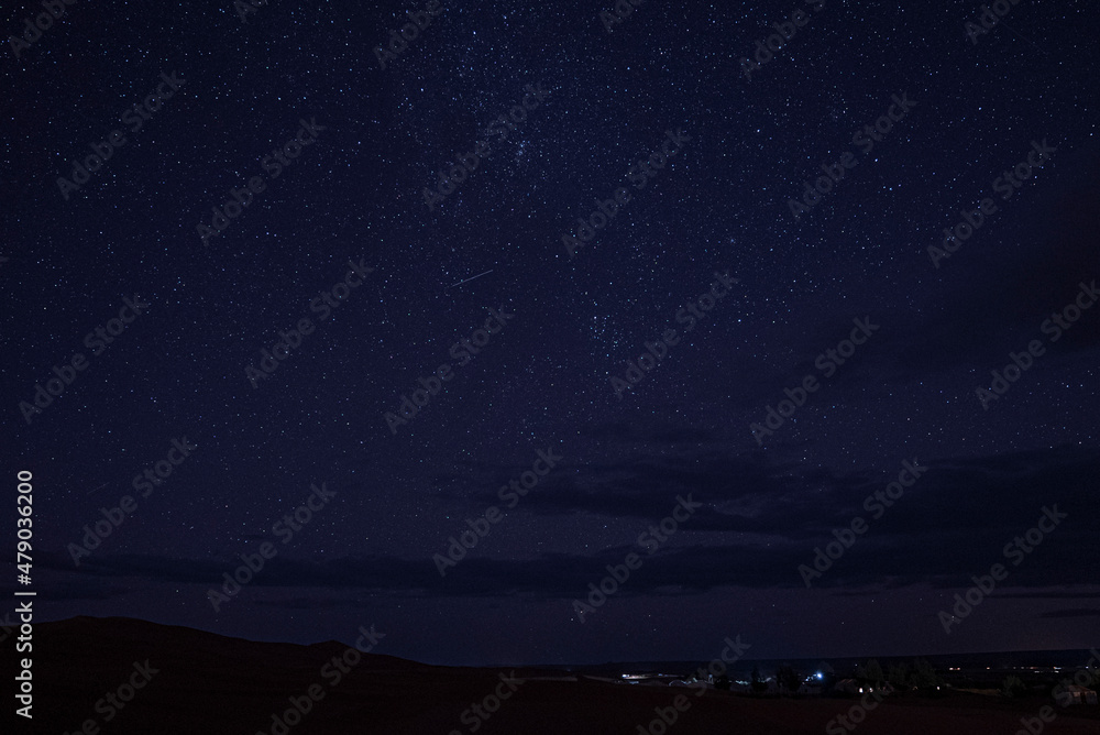 Beautiful view of stars over sand in sahara desert at night, Silhouette ...