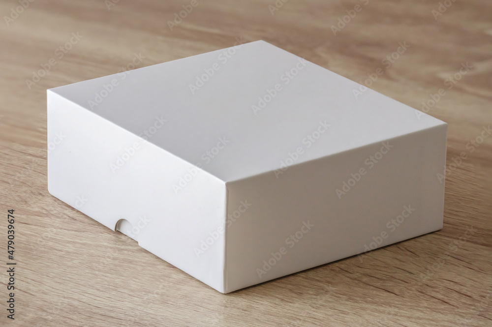 Mockup white box on wood table background Stock Photo | Adobe Stock