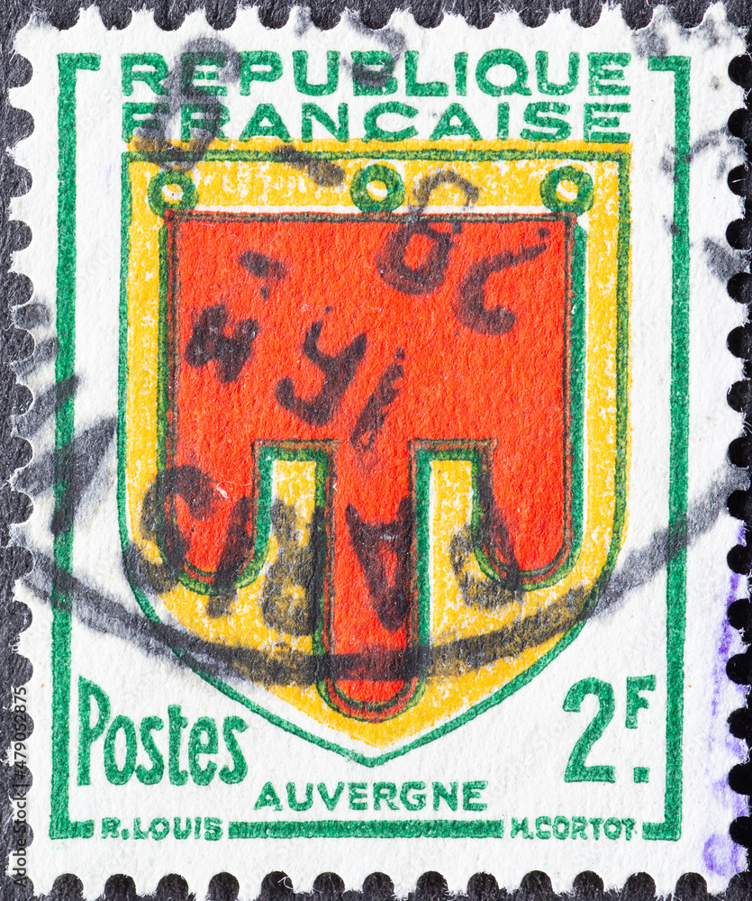 France - circa 1949: A post stamp from France showing the coat of arms ...