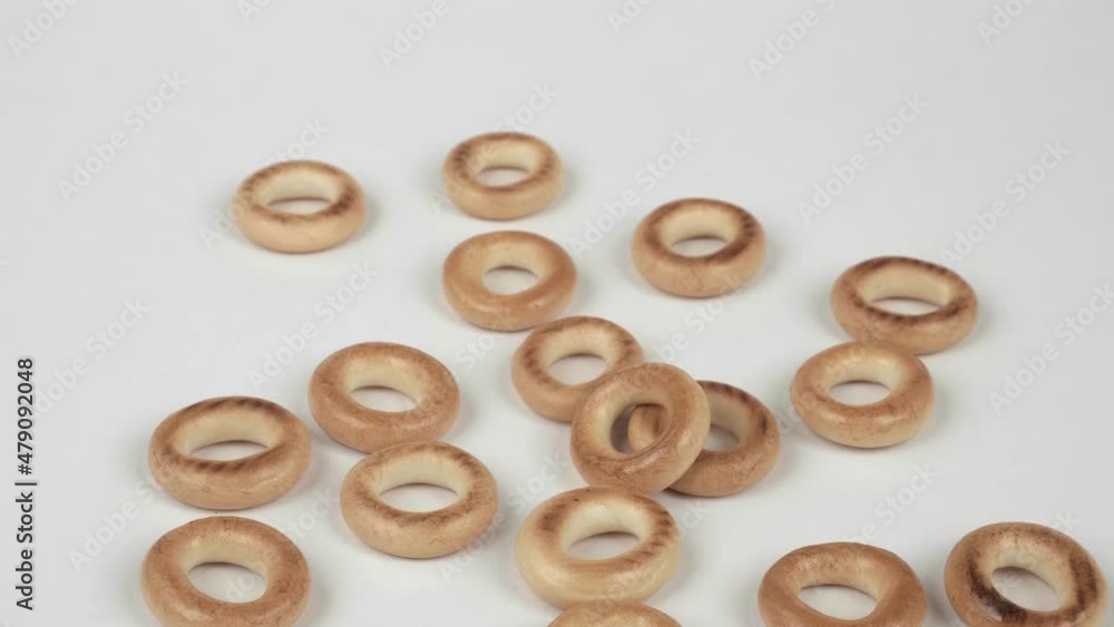 A woman's hands scattered sushki materials on a white background ...