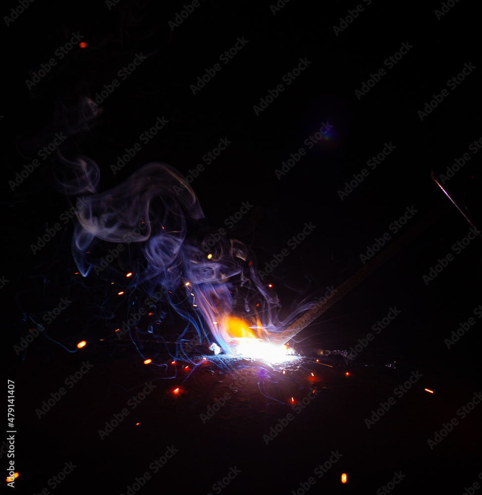 Welding flame while working with a semi-automatic welder. Stock Photo ...