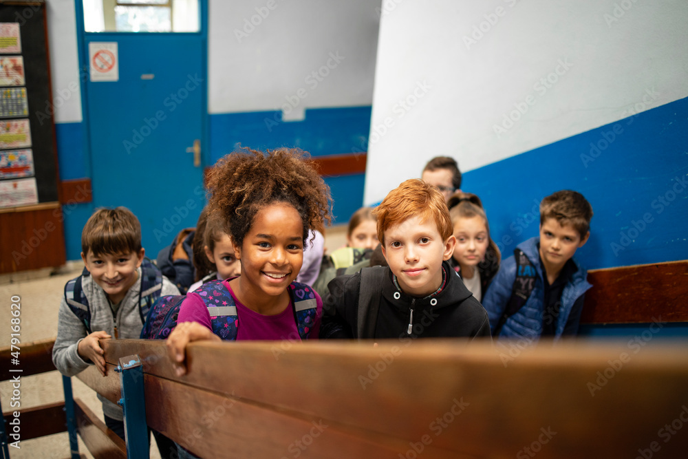 Group of happy smiling multicultural children going together to the ...