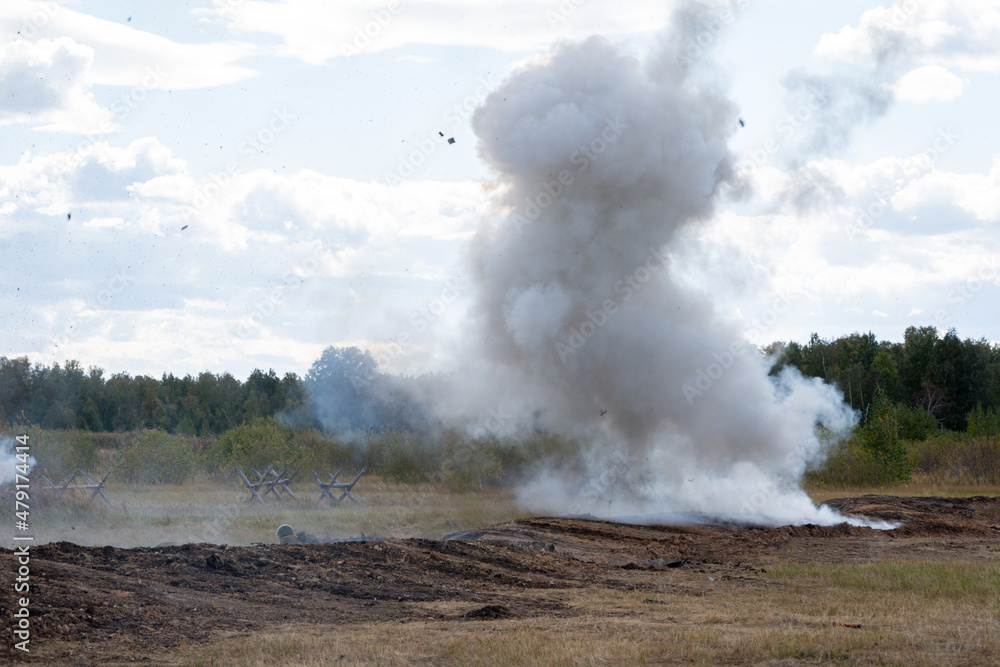 Attack of Soviet soldiers from the trenches. Smoke from an exploding ...