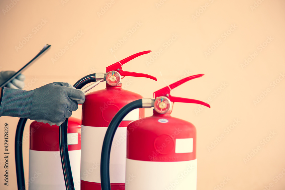 Engineer inspection checking pressure gauge level fire extinguisher of ...
