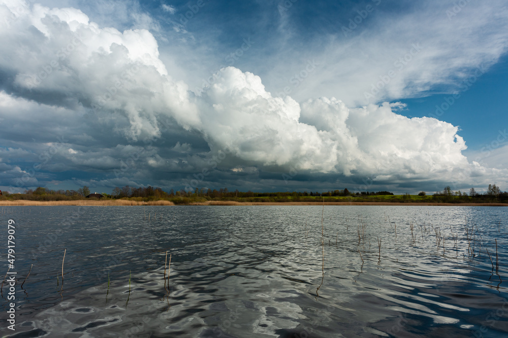 cloudy landscape in the lake and the sea with kayaks Stock Photo ...