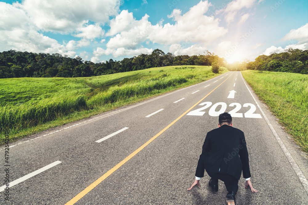 The 2022 New Year journey and future vision concept . Businessman ...