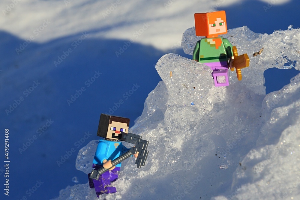 LEGO Minecraft figures of Steve with iron pickaxe and Alex with golden ...