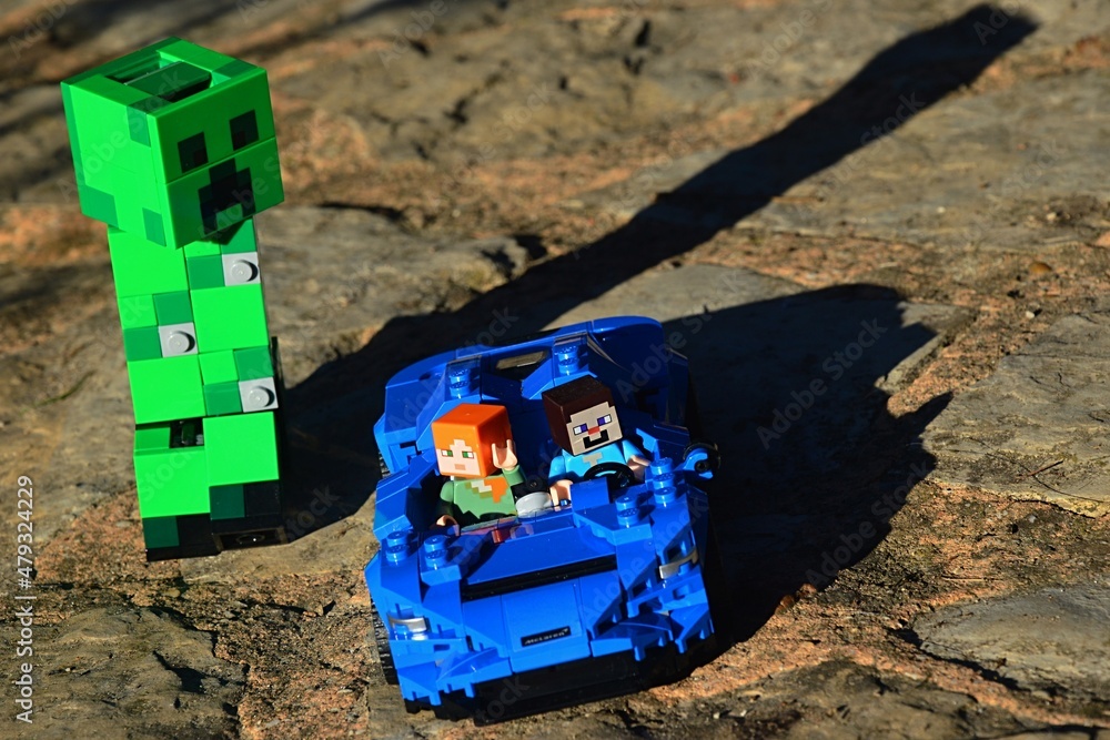 LEGO Minecraft figures of Steve and Alex escaping from giant green ...