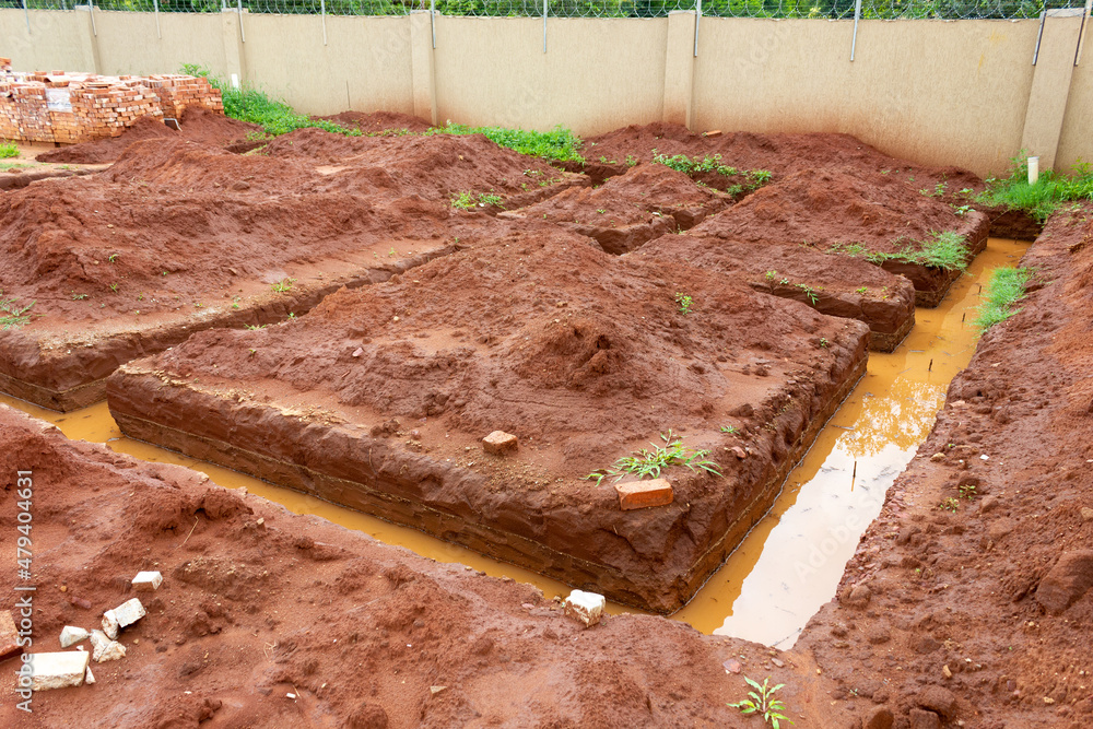 Building foundation that was dug in sand soil. The dug out soil was ...
