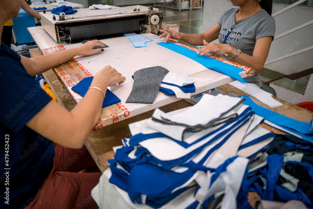 Close up hand of woman putting the fusing into fabric with Industrial ...