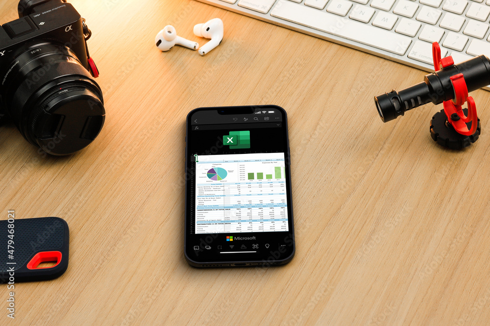 Microsoft Office Excel app on smartphone iPhone 13 screen on wooden ...