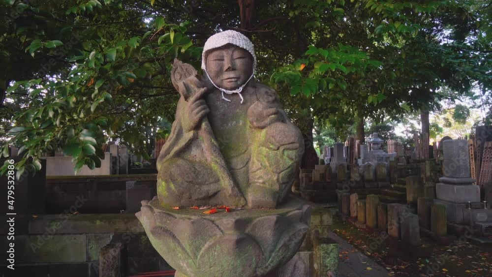 It is very common in the cemeteries of Buddhist temples in Japan to see ...