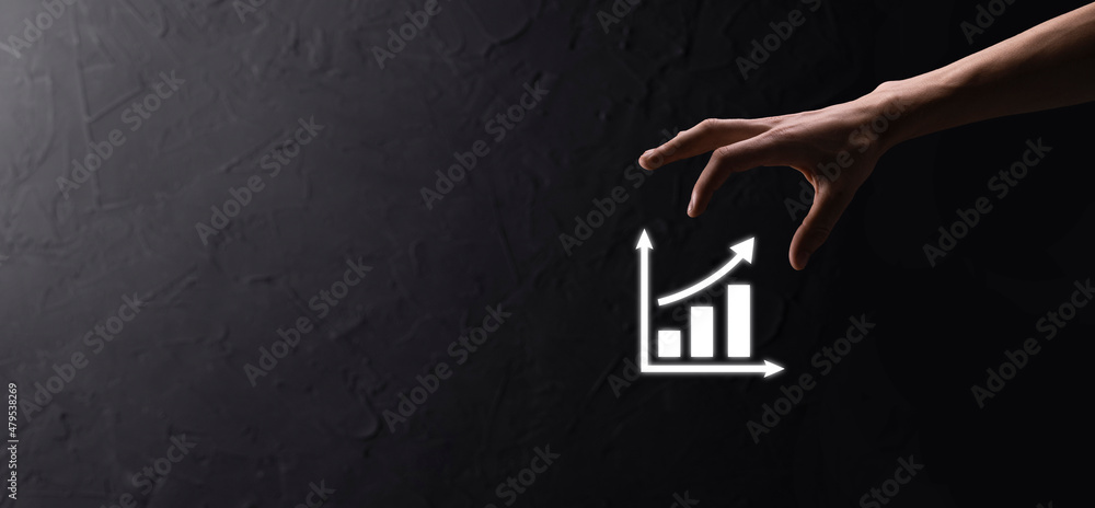 Businessman man holding a graph with positive profits growth. plan ...