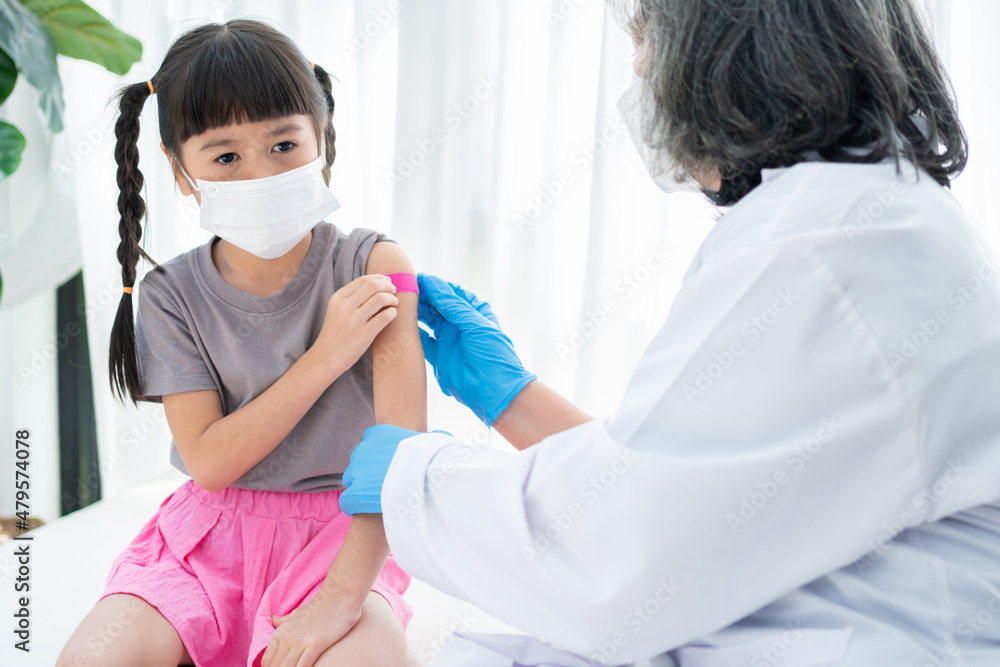 Doctor is affixing the medicinal plaster after vaccinated in shoulder ...