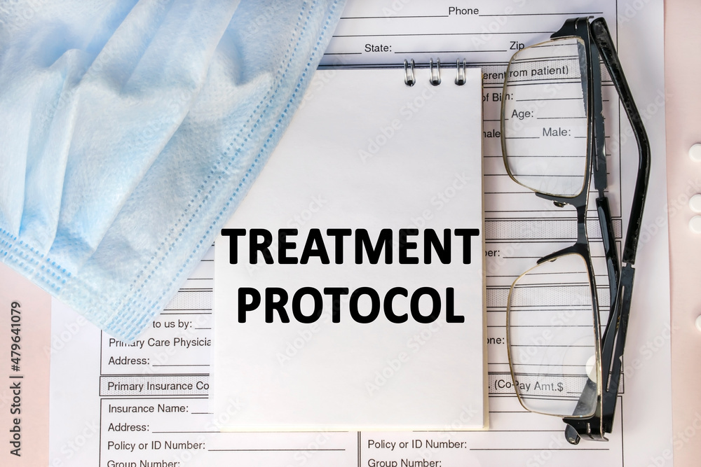 the treatment protocol is written on a notebook that is on the sick ...