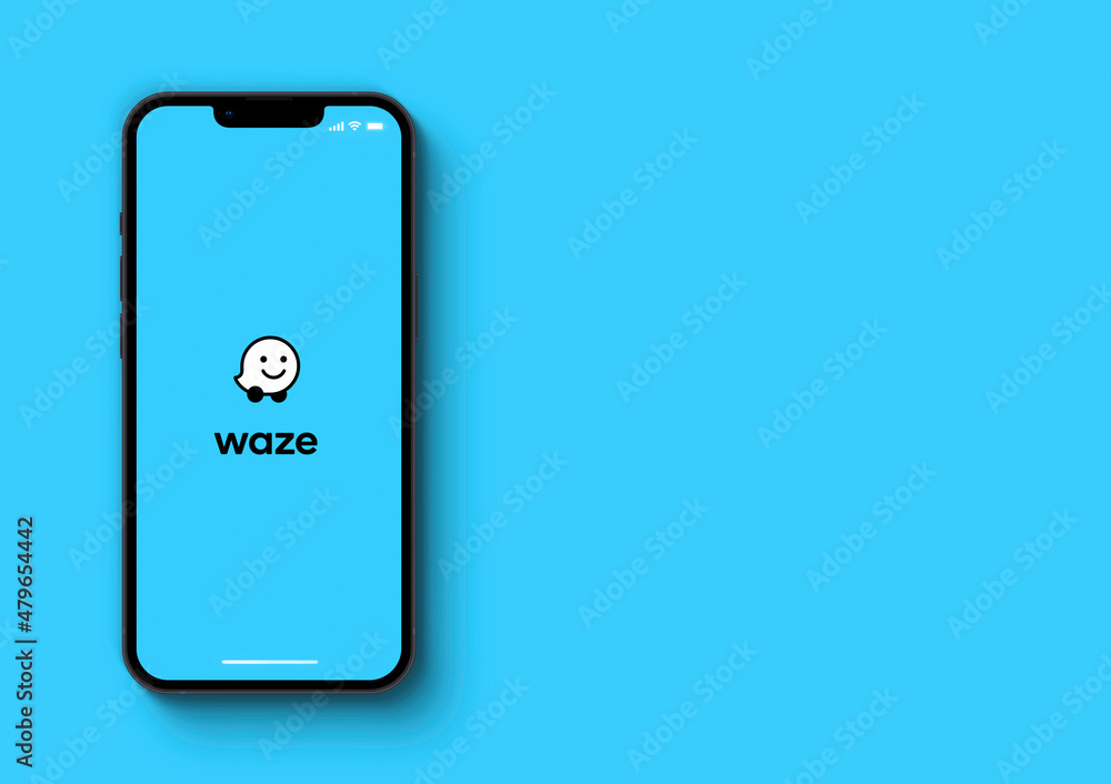 Waze app on the smartphone iPhone 13 screen. Blue background. Rio de ...